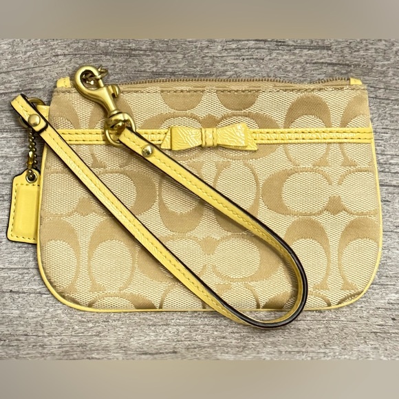 Coach | Bags | Coach Tan Signature Wristlet W Yellow Patten Leather Bow ...